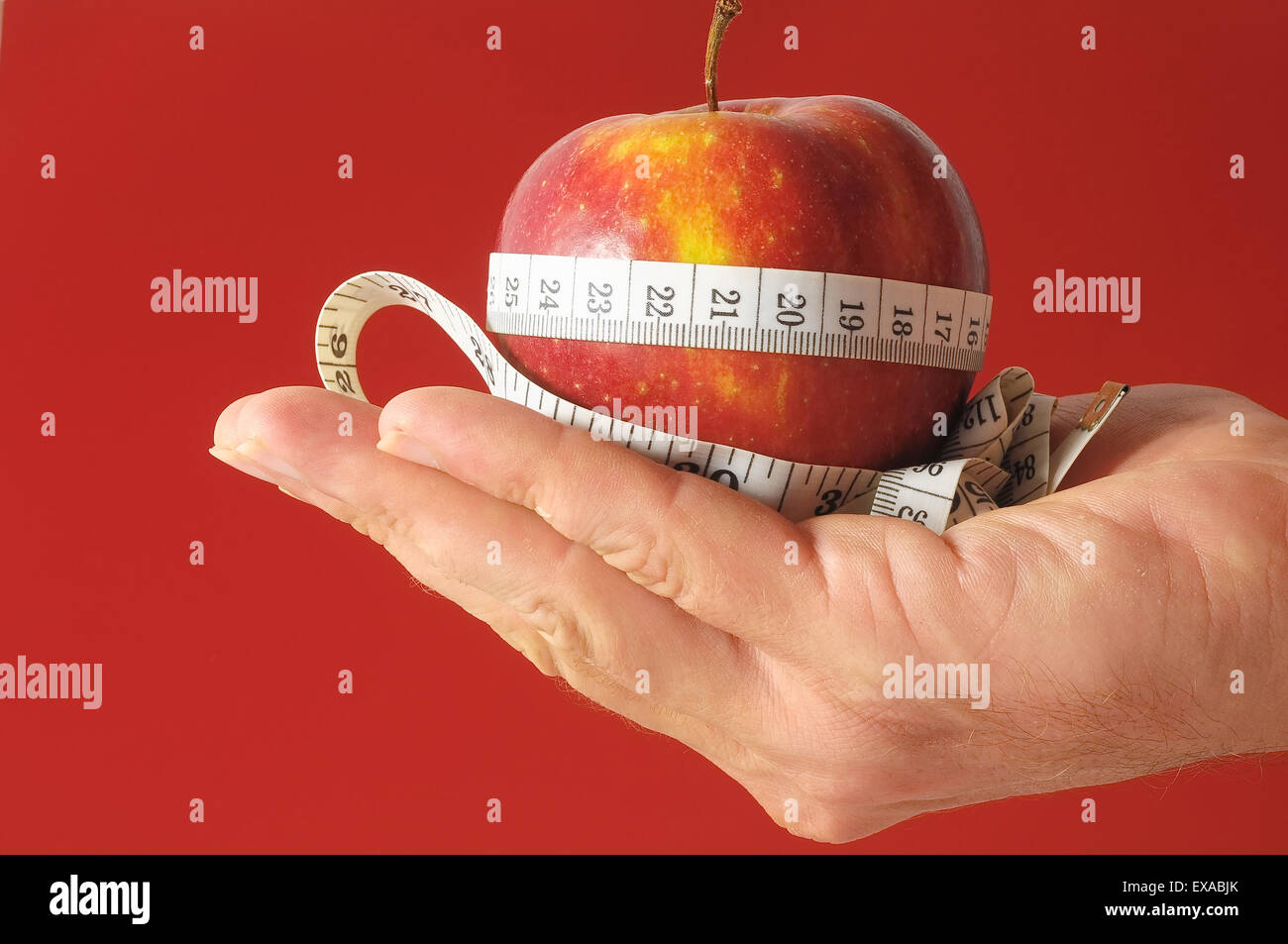 Diet Apple and Meter on the Hand Stock Photo - Alamy