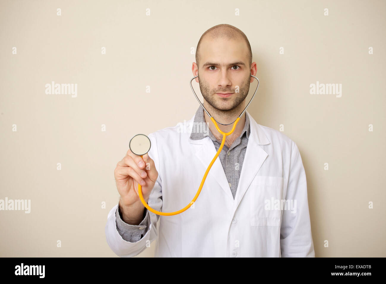 Portrait of a doctor of stethoscope isolated on light background Stock ...