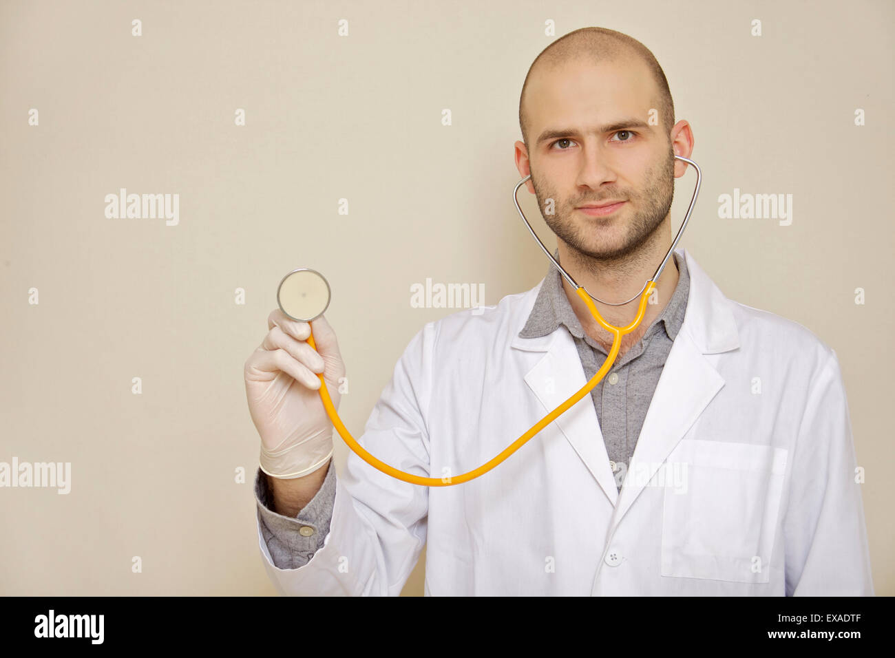 Portrait of a doctor of stethoscope isolated on light background Stock ...