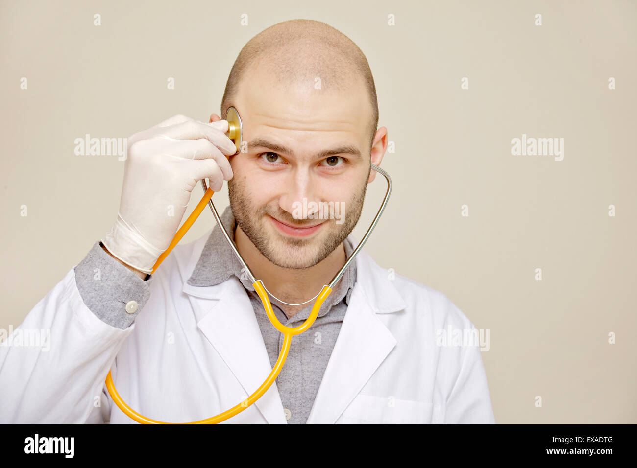 Portrait of a doctor of stethoscope isolated on light background Stock ...