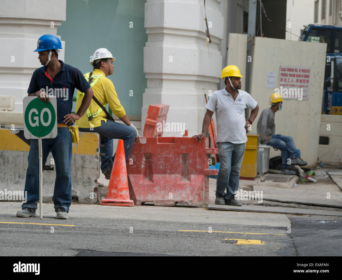 Migrant construction workers at building site in Singapore Stock Photo ...