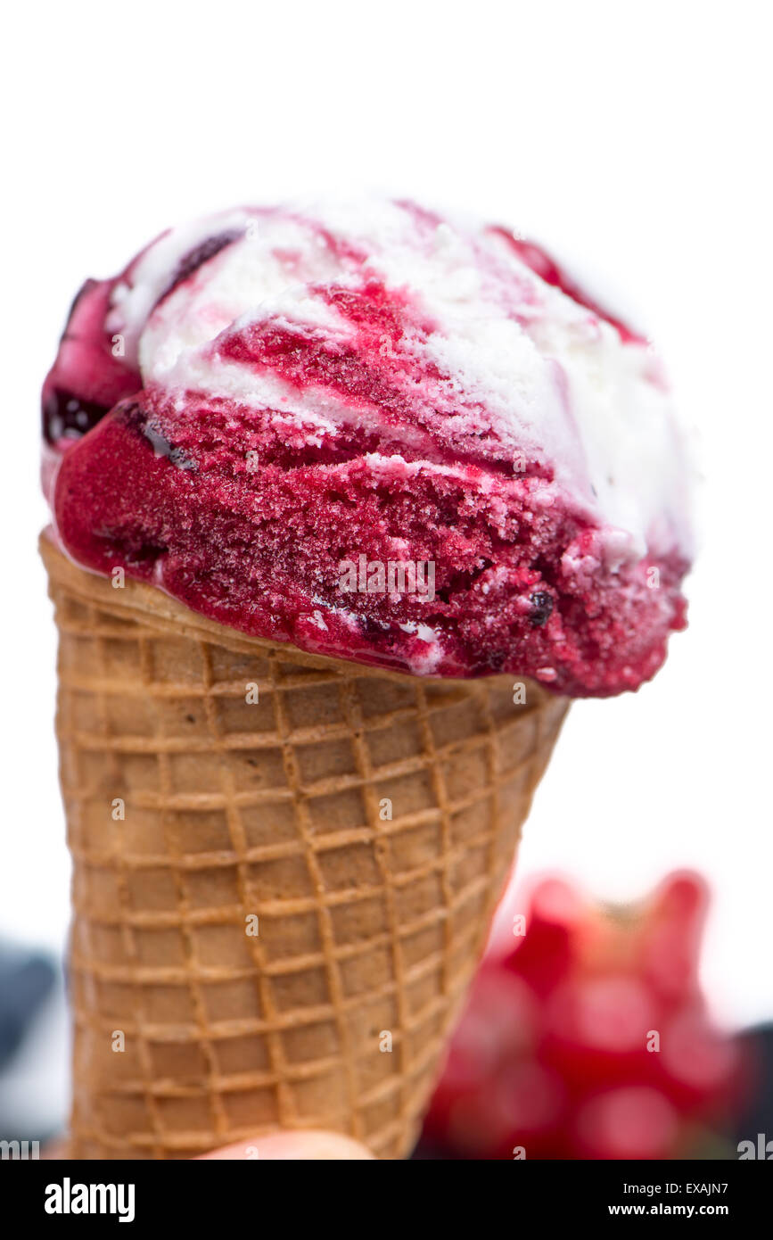 Ice cream cone with scoop of red fruits isolated on white background ...