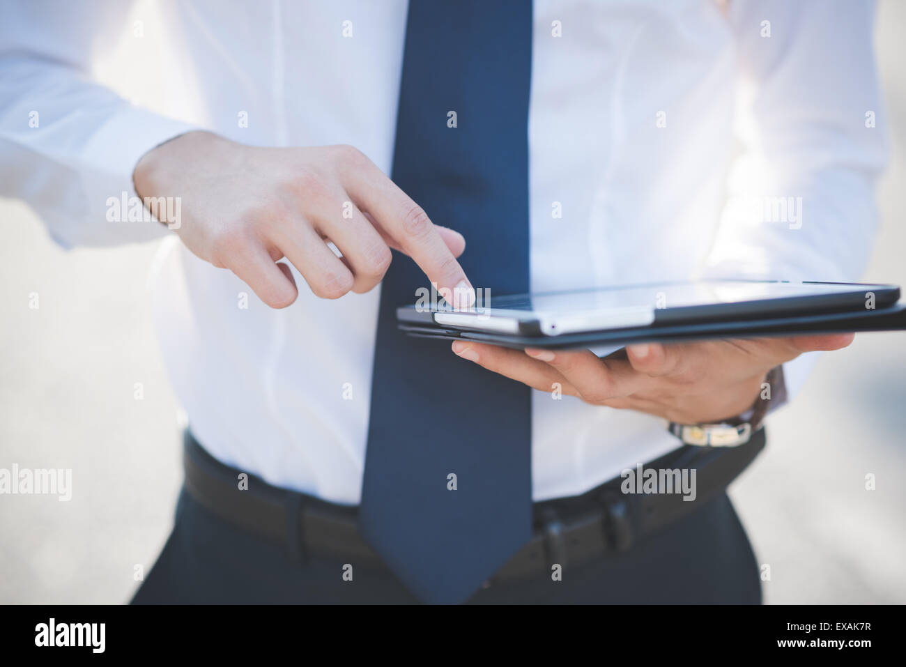 close up businessman man hand using tablet device outdoor Stock Photo ...