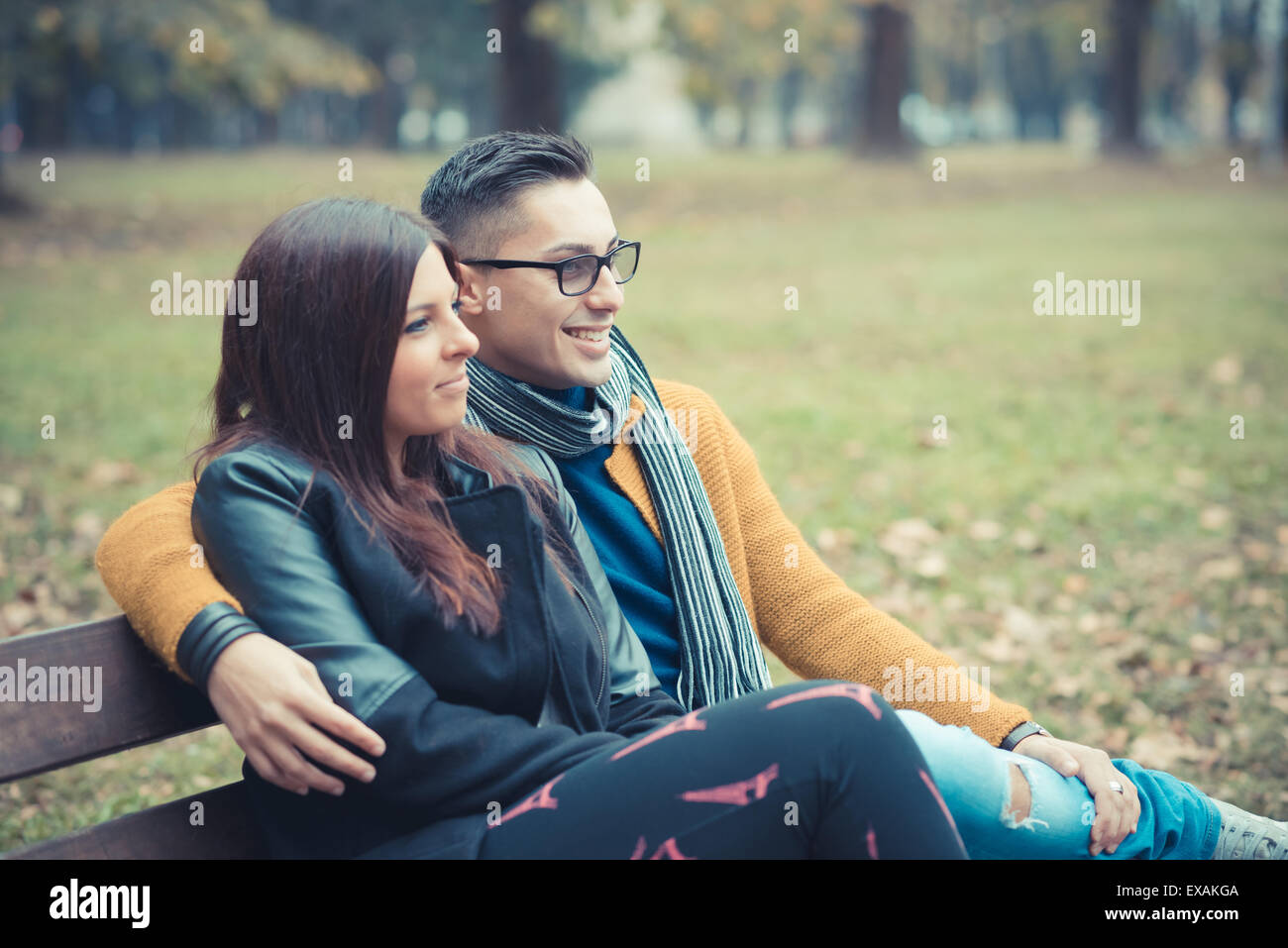 young couple in the park during autumn season outdoor - lovers ...