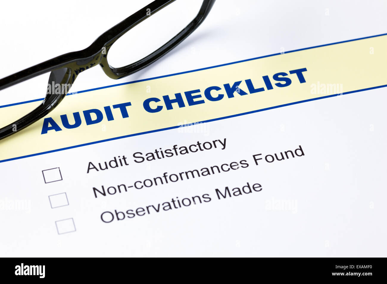 Audit checklist form with glasses Stock Photo - Alamy
