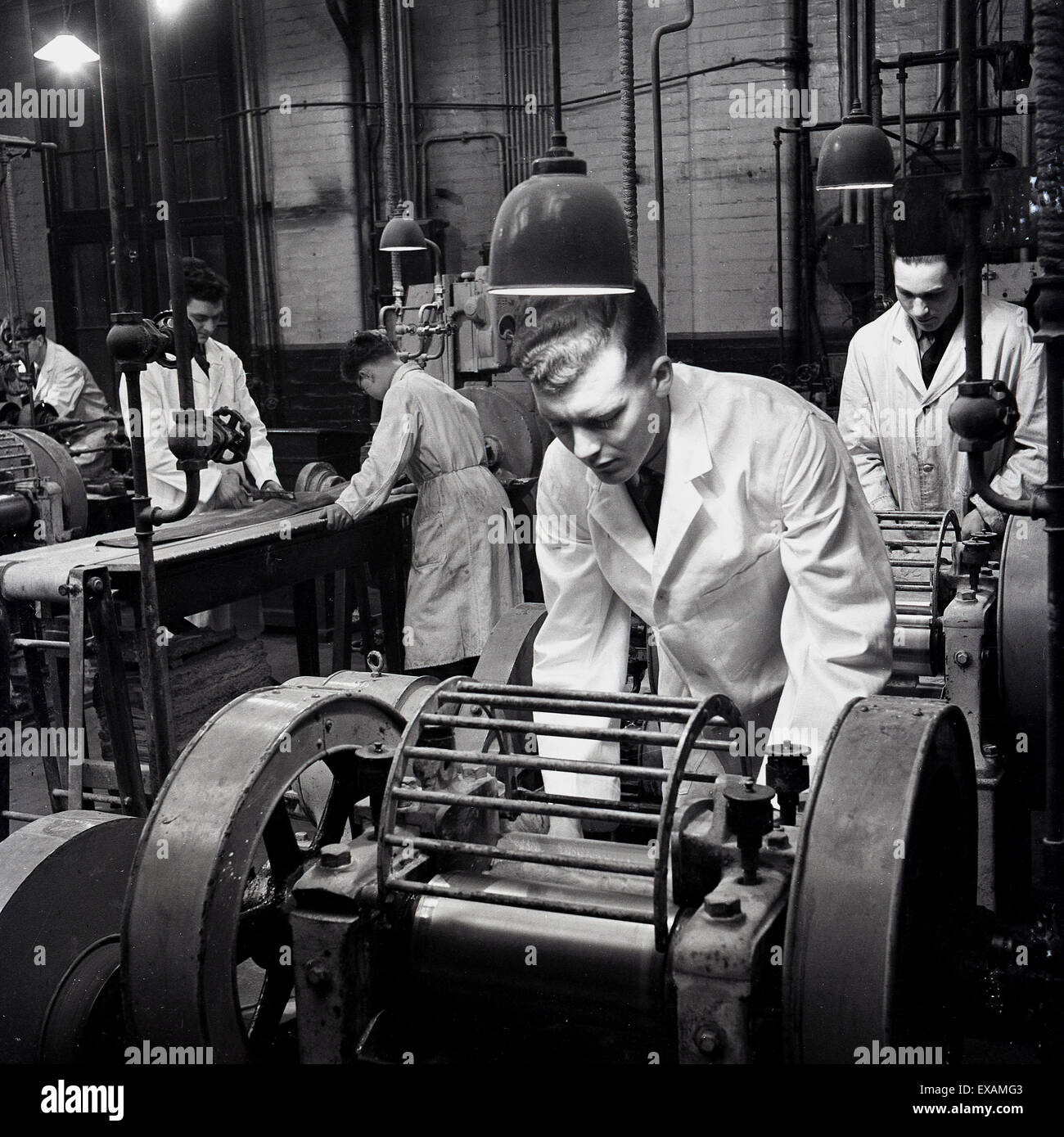 1950s, oung male engineering apprentices in workshop Stock Photo - Alamy