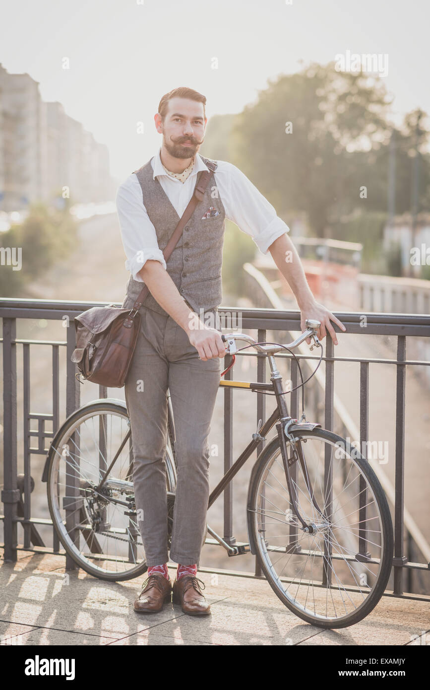 handsome big moustache hipster man with bicycle in the city Stock Photo ...