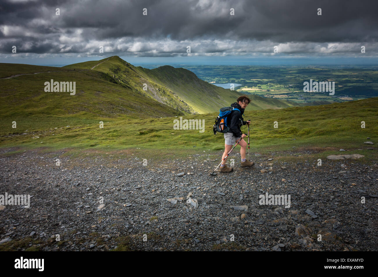 Female walker person approaching the final path ascent up Skiddaw, Lake ...