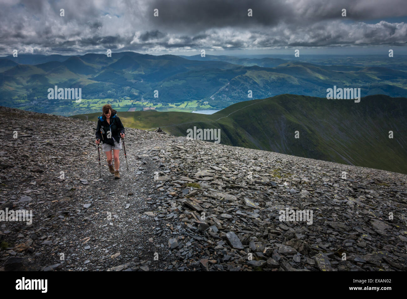 Female walker person approaching the summit path of Skiddaw, English ...