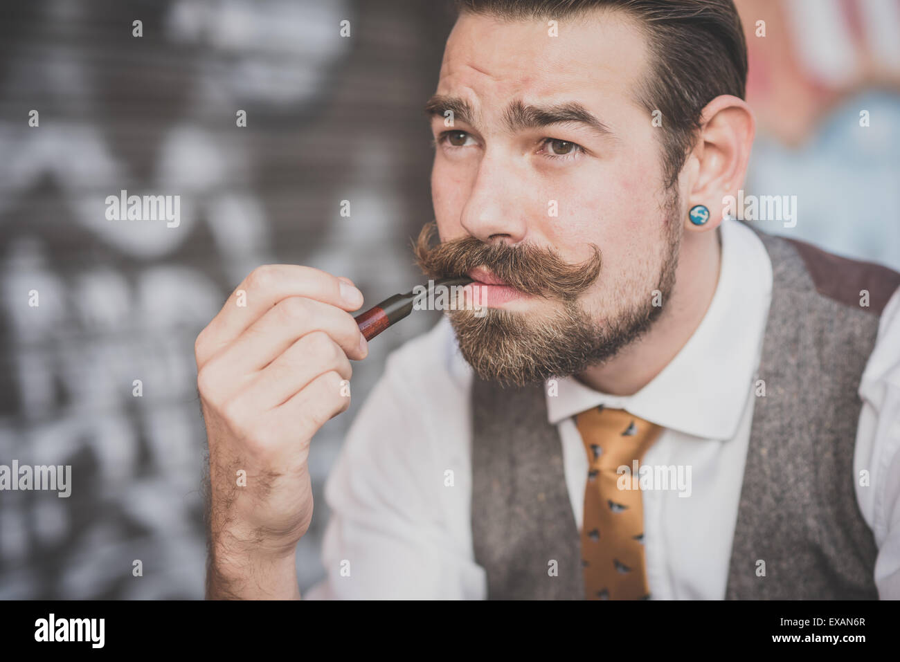 handsome big moustache hipster man smoking pipe in the city Stock Photo ...