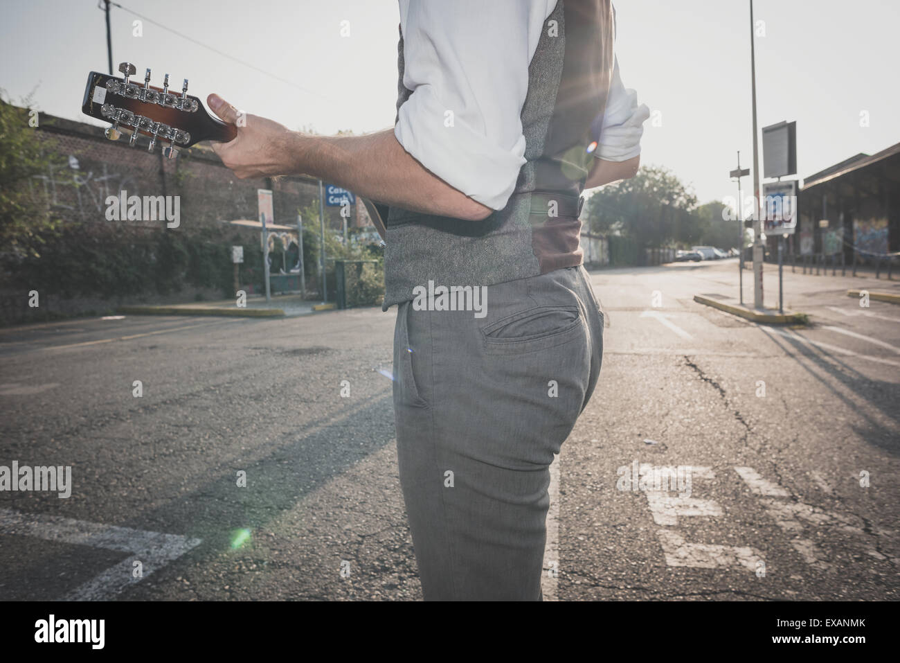 handsome big moustache hipster man playing mandolin in the city Stock ...