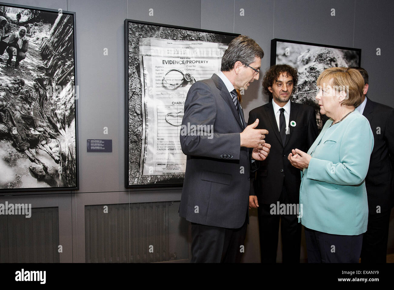 HANDOUT - A handout showing German Chancellor Angela Merkel attending ...