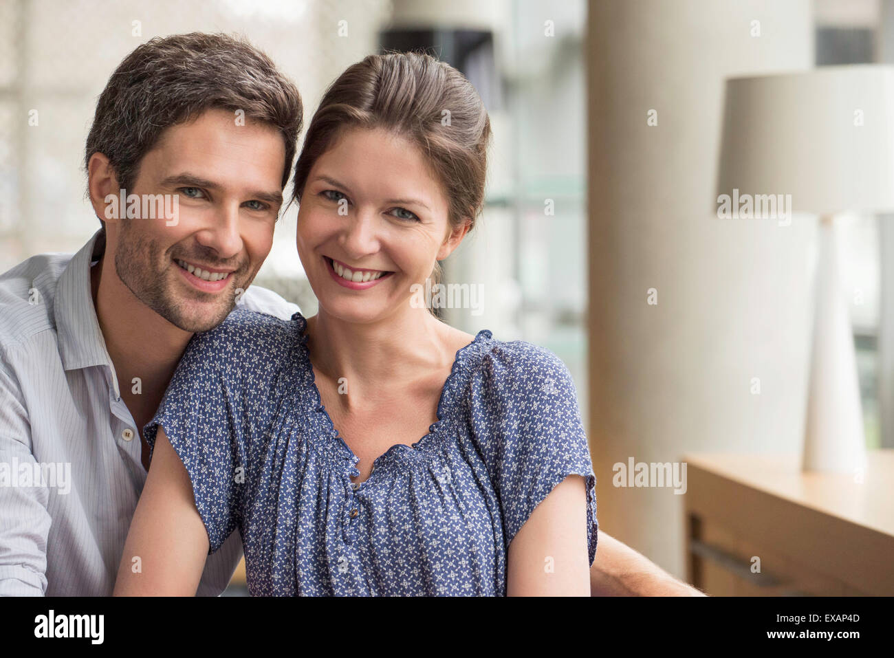 Couple smiling together at home, portrait Stock Photo - Alamy