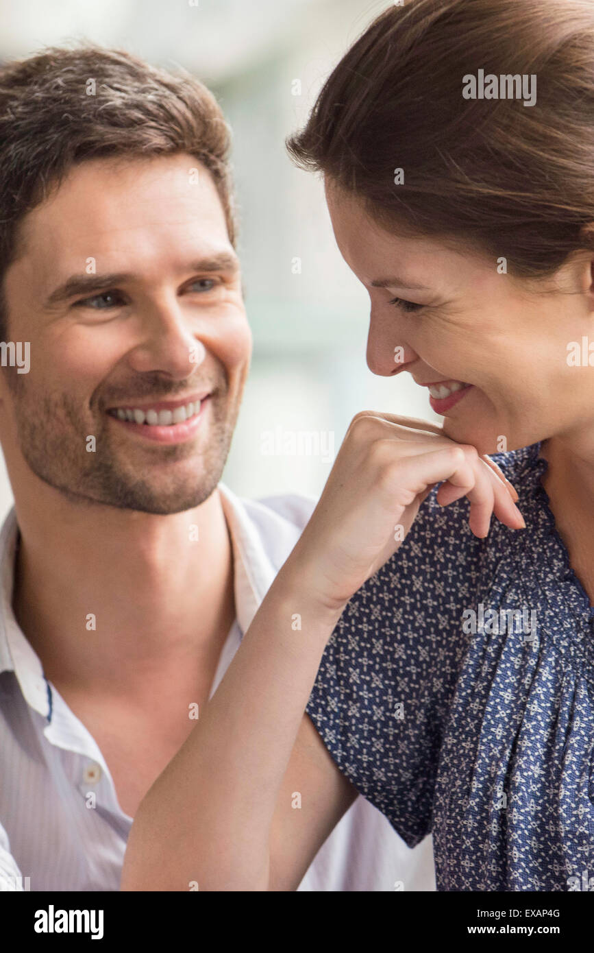 Cheerful couple sits together in hi-res stock photography and images ...