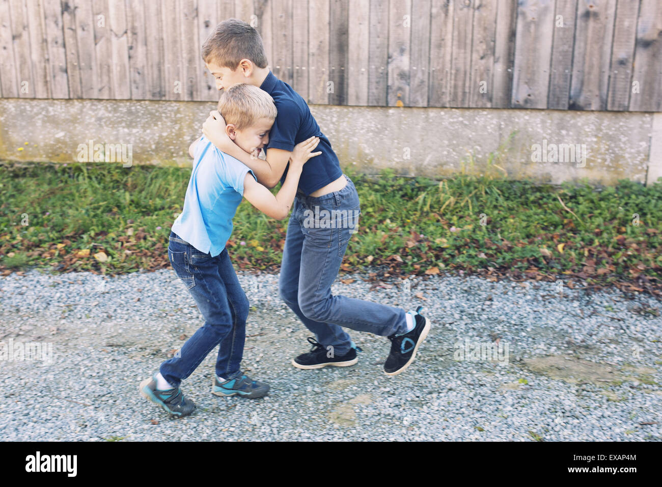 Four children playing outside hi-res stock photography and images - Alamy