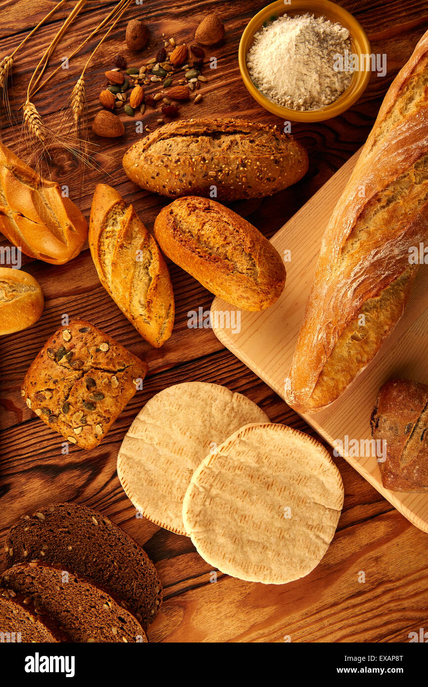 Bread fresh varied mix on golden rustic wood golden table Stock Photo ...