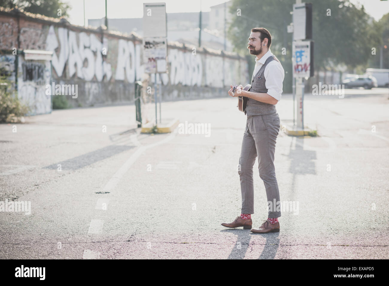 handsome big moustache hipster man playing mandolin in the city Stock ...