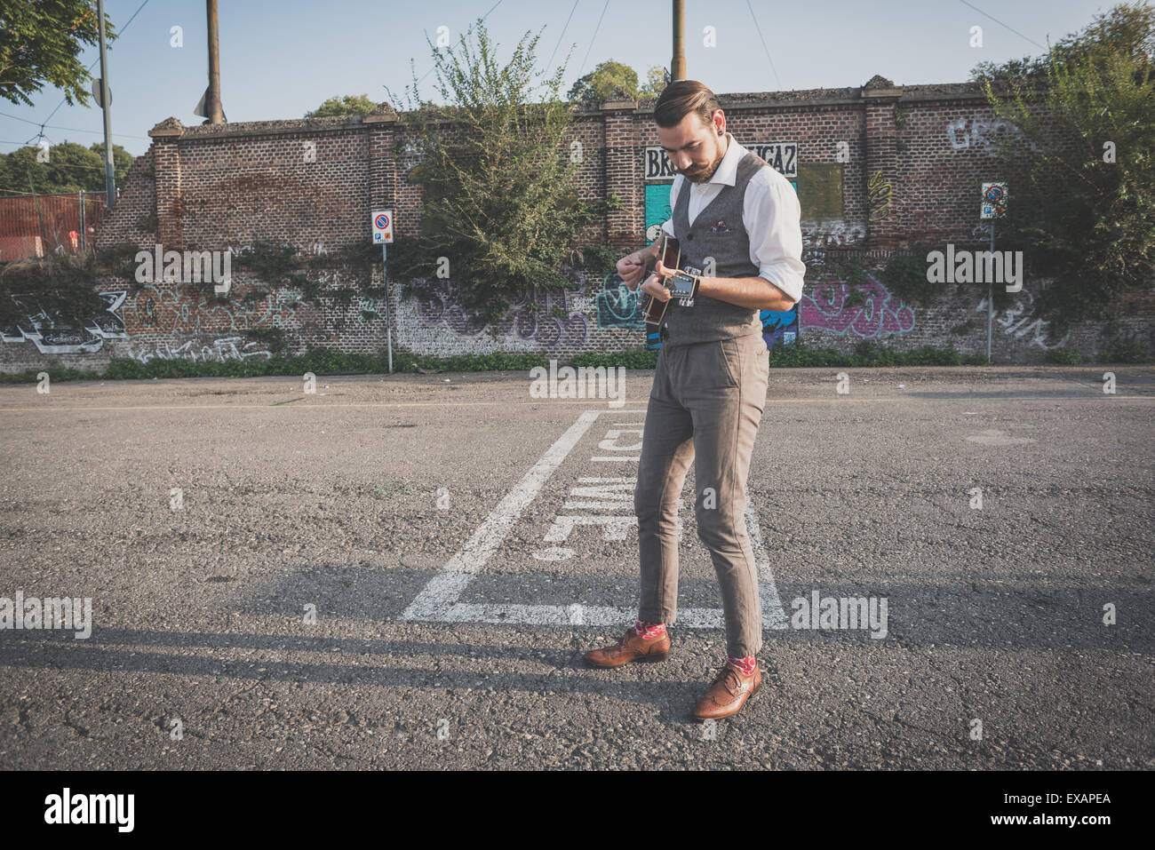 handsome big moustache hipster man playing mandolin in the city Stock ...