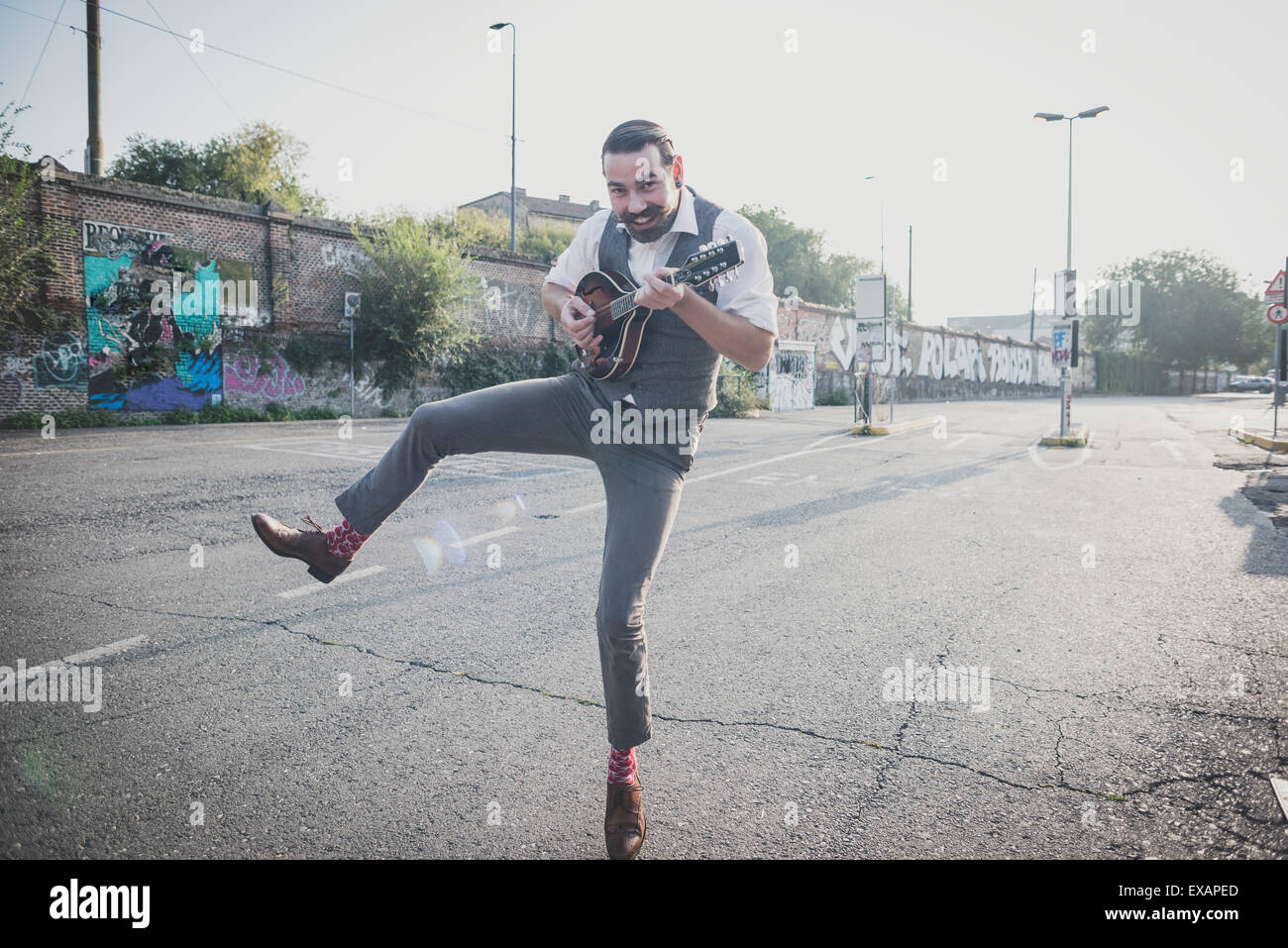 handsome big moustache hipster man playing mandolin in the city Stock ...
