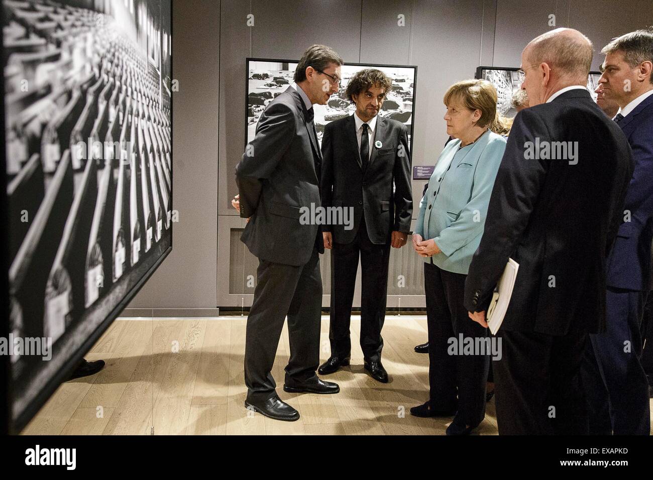 HANDOUT - A handout showing German Chancellor Angela Merkel attending ...