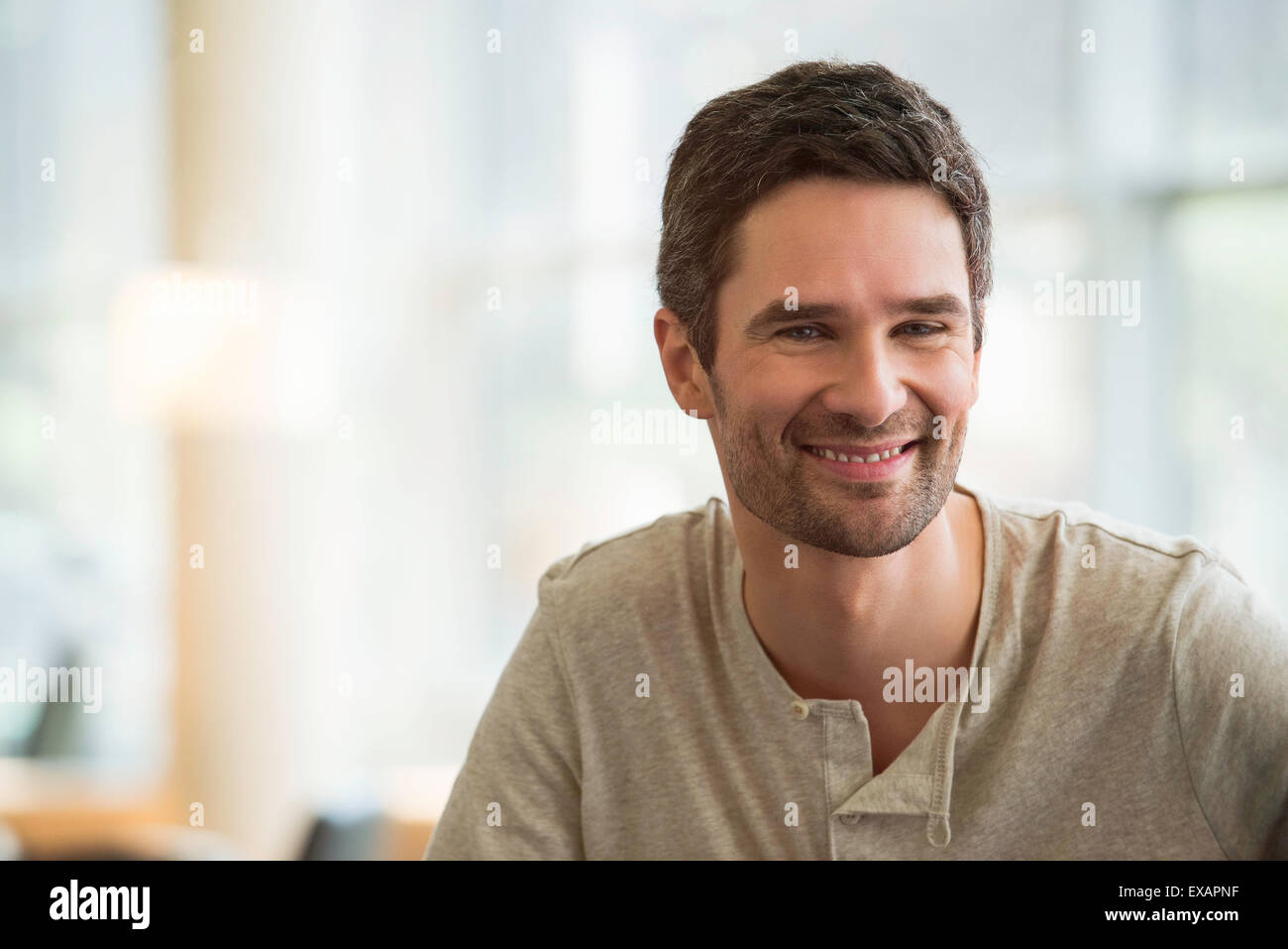 Man smiling cheerfully, portrait Stock Photo - Alamy
