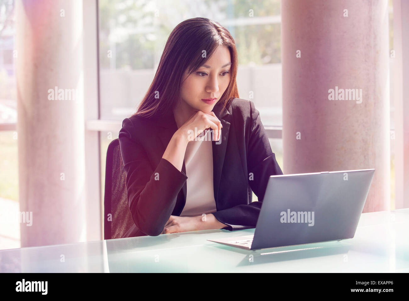Woman using laptop computer Stock Photo - Alamy