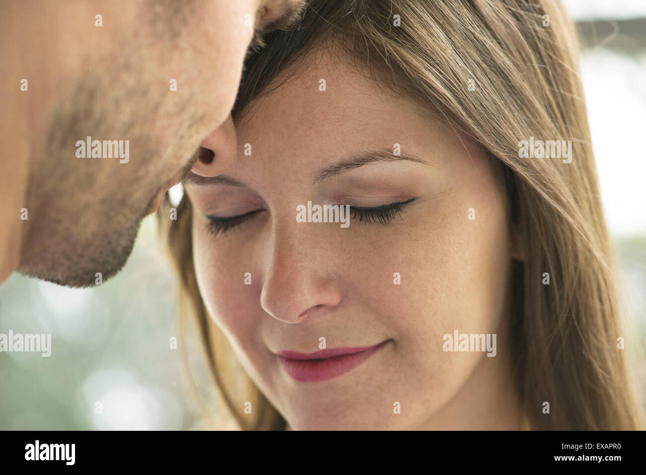 Couple nuzzling, close-up Stock Photo - Alamy