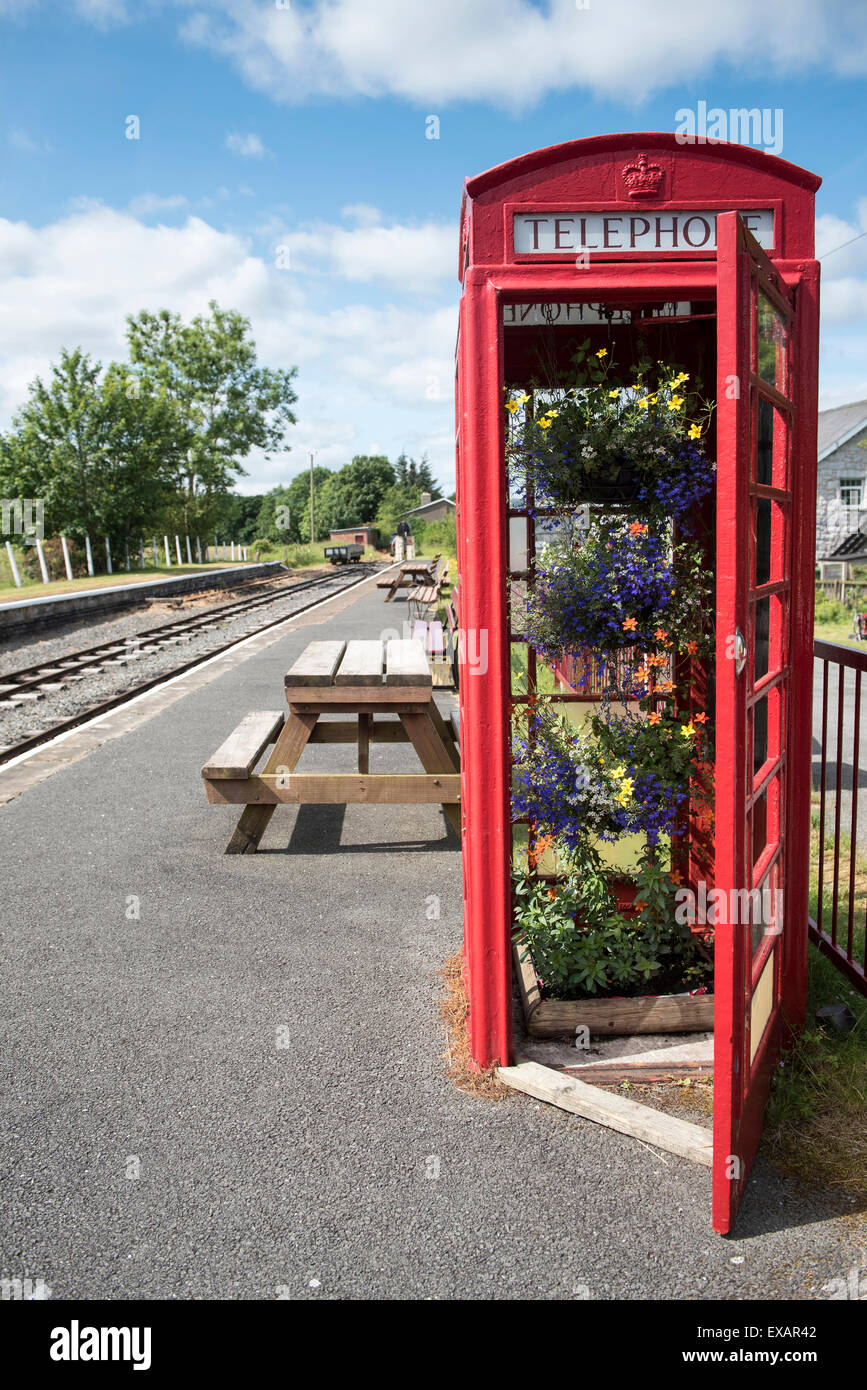 Red telephone box filled with flowers and potted plants, Bala Lake ...