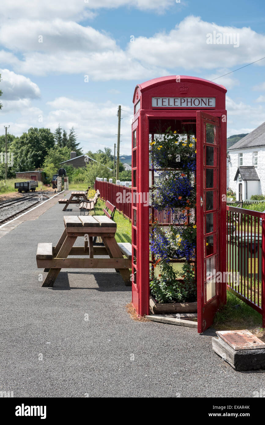 Red telephone box filled with flowers and potted plants, Bala Lake ...