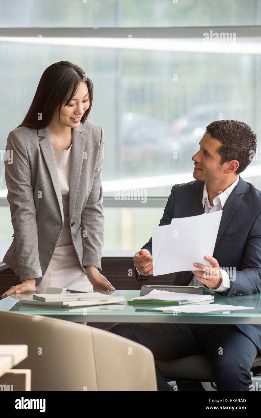 Collaborating office desk young professionals hi-res stock photography ...