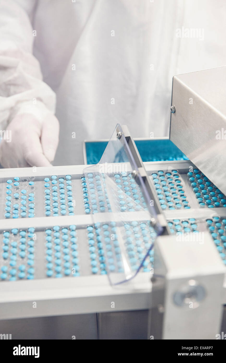 Technicians monitoring drug production hi-res stock photography and ...