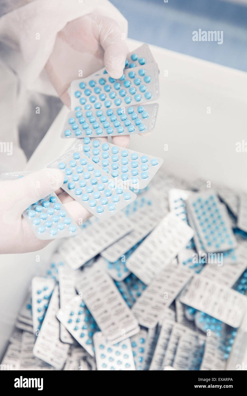 Inspecting packages of prescription drugs in manufacturing plant Stock ...