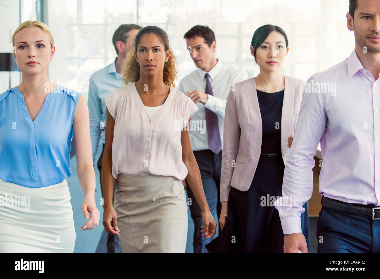 Officer workers marching in unison Stock Photo - Alamy