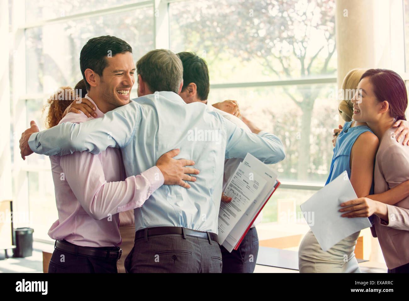 Business associates celebrating team success Stock Photo - Alamy
