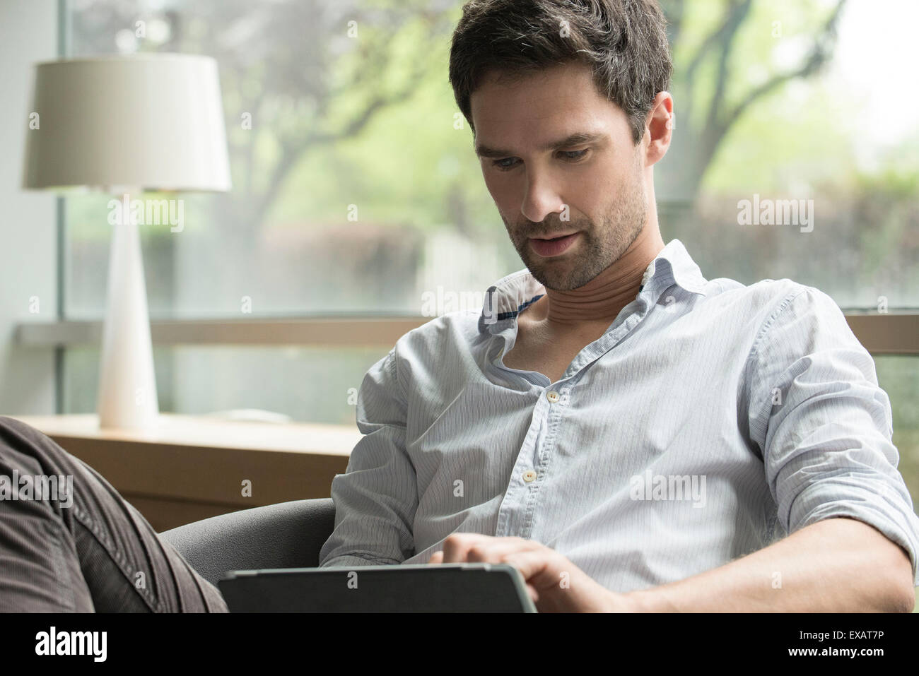 Person using twitter tablet hi-res stock photography and images - Alamy