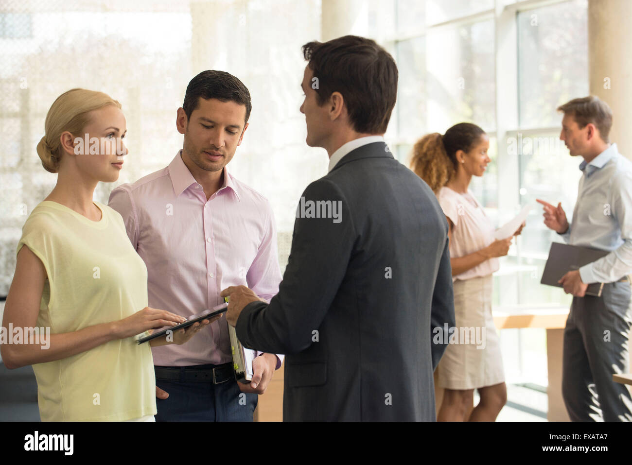 Mature customer young salesman hi-res stock photography and images - Alamy