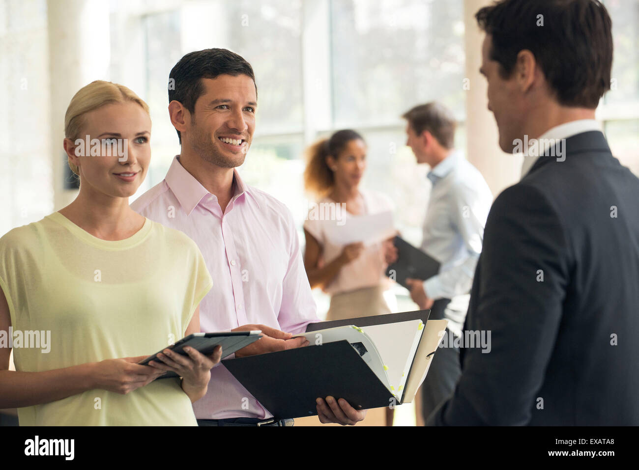 Salesman meeting with clients Stock Photo - Alamy