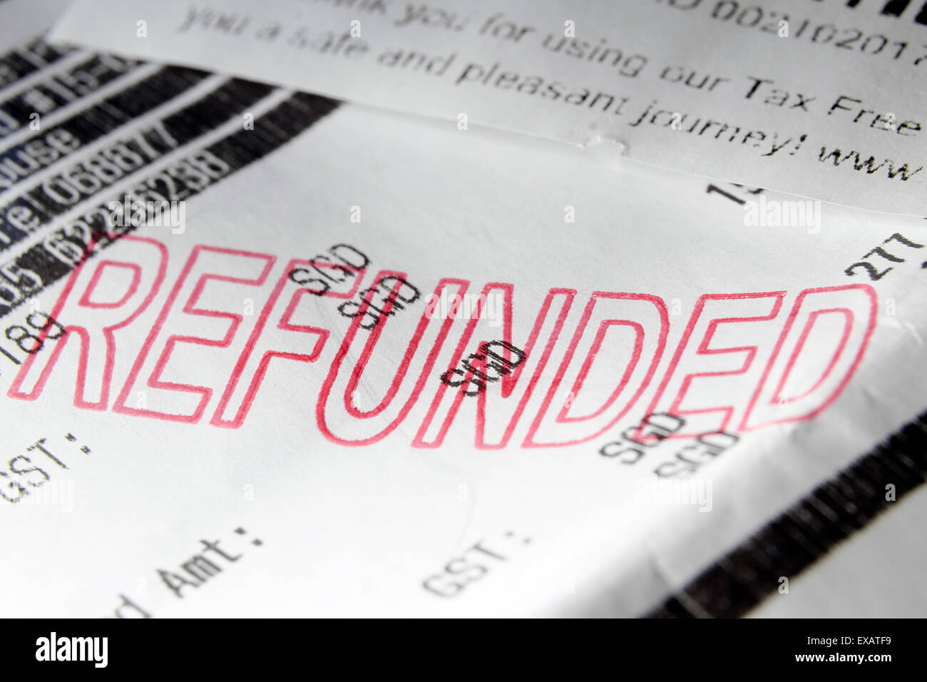 red stamp REFUNDED on Duty Free shopping receipt Stock Photo - Alamy