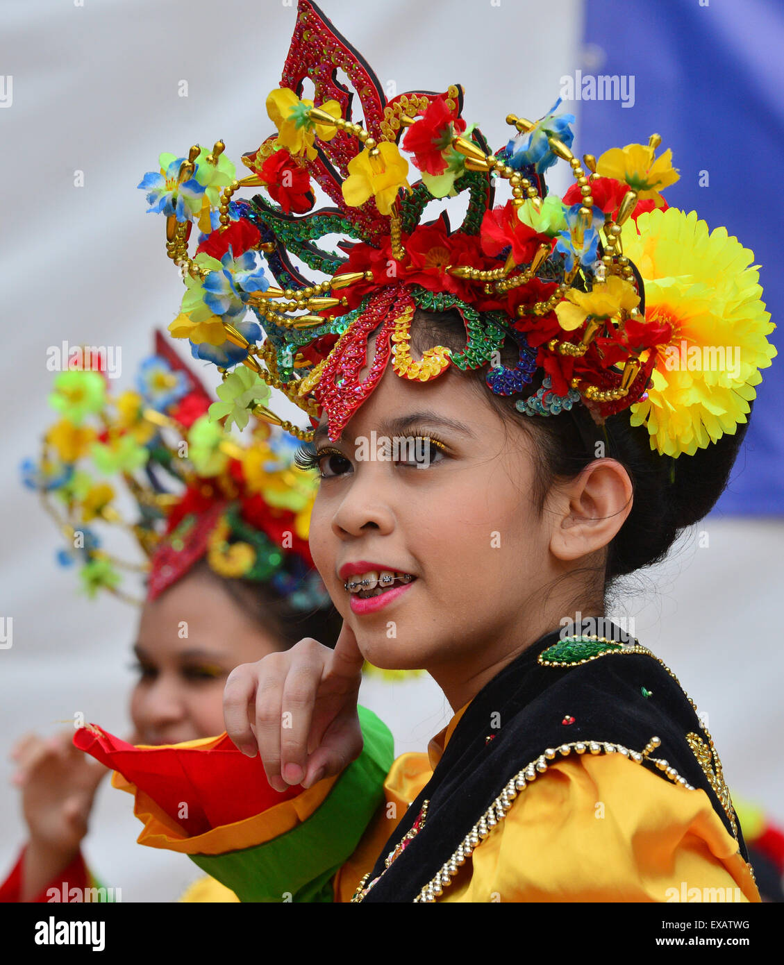 The dancers of the "Sma Negeri 68 Group" from Indonesia perform at the ...