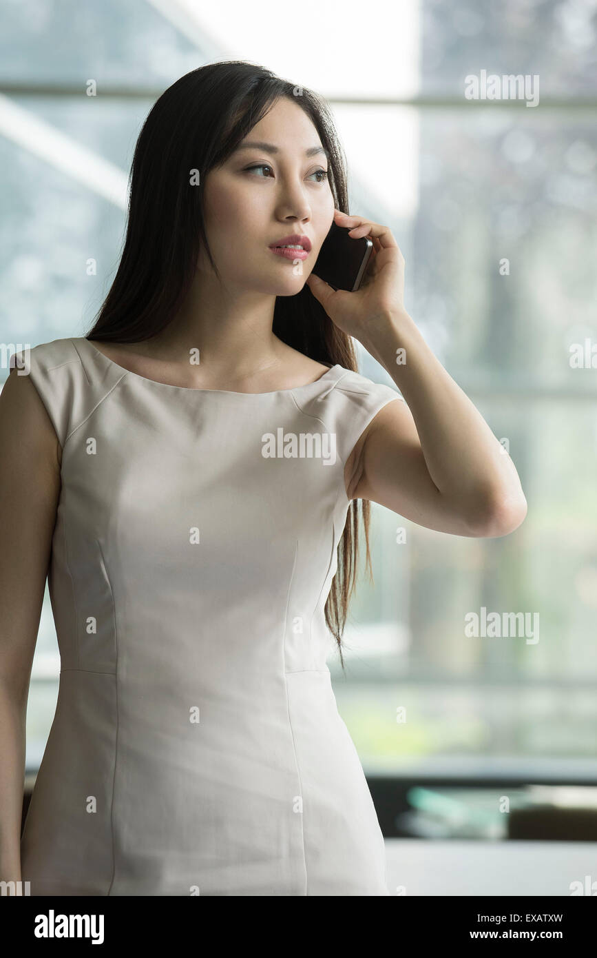 Woman using cell phone Stock Photo - Alamy
