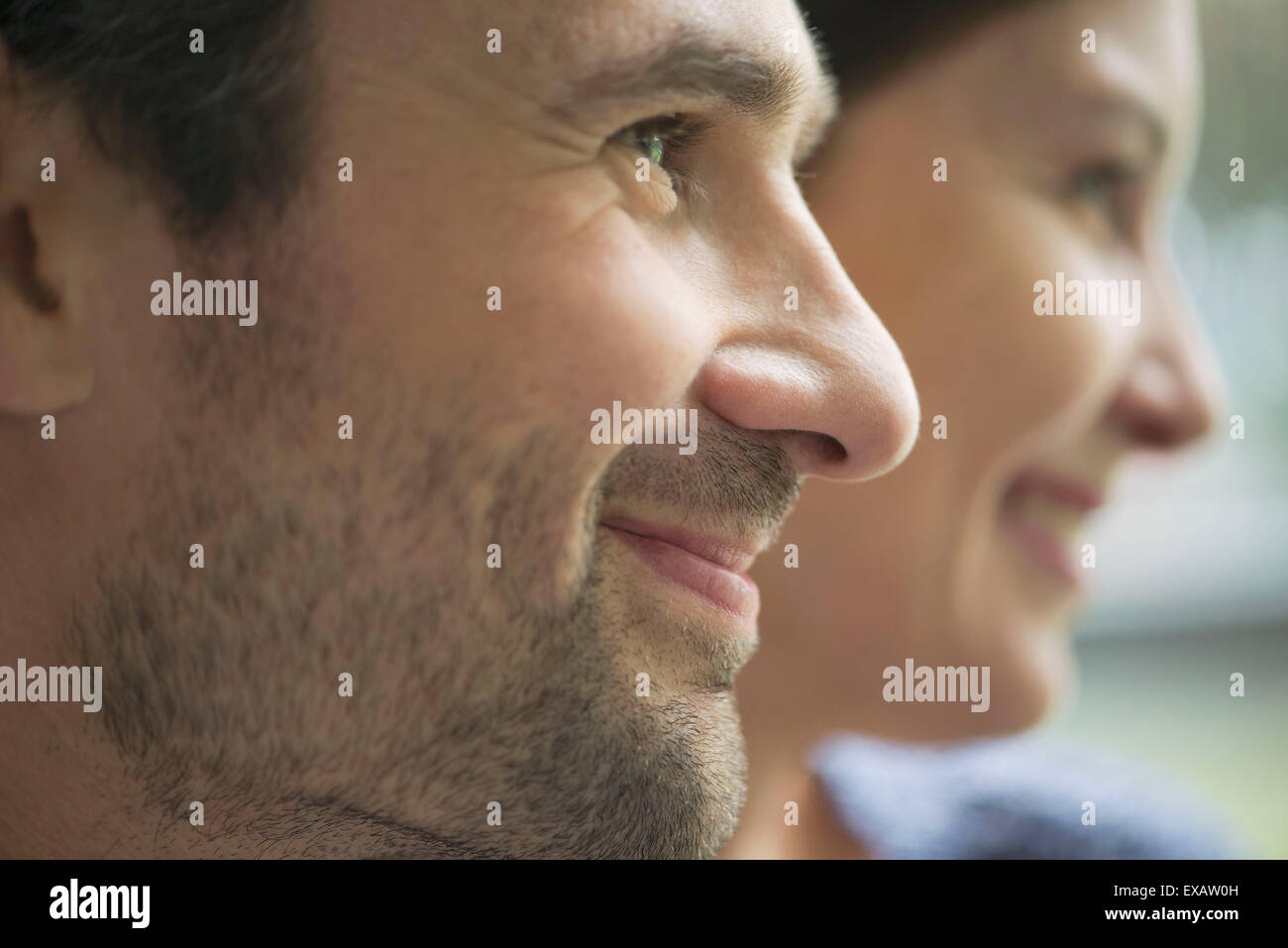 Couple in profile, smiling Stock Photo - Alamy