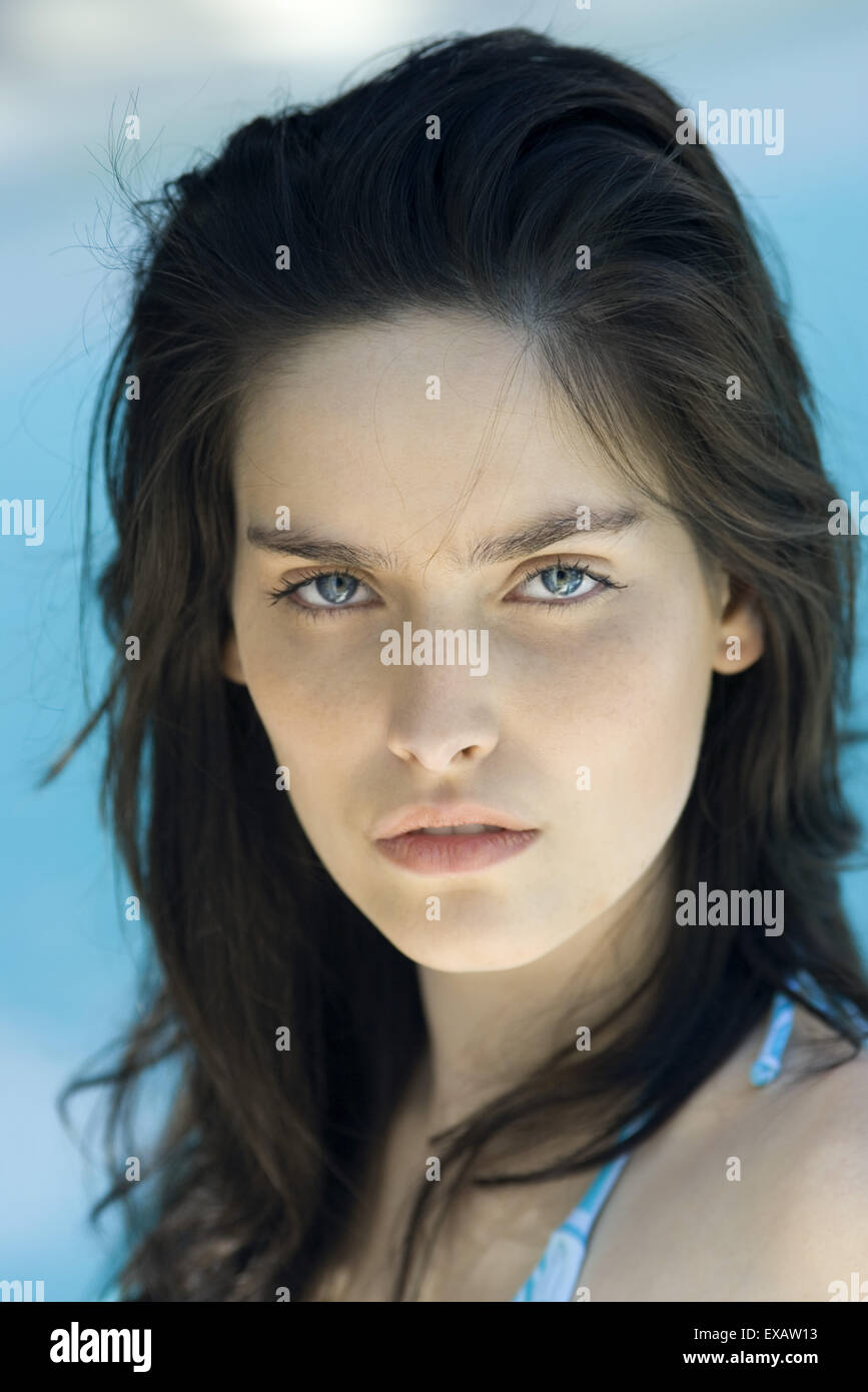 Young woman staring at camera, portrait Stock Photo - Alamy