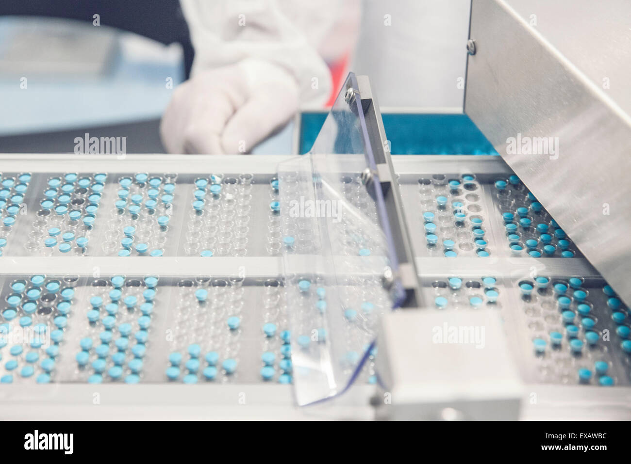 Tablet trays passing into prescription drug packaging equipment Stock ...