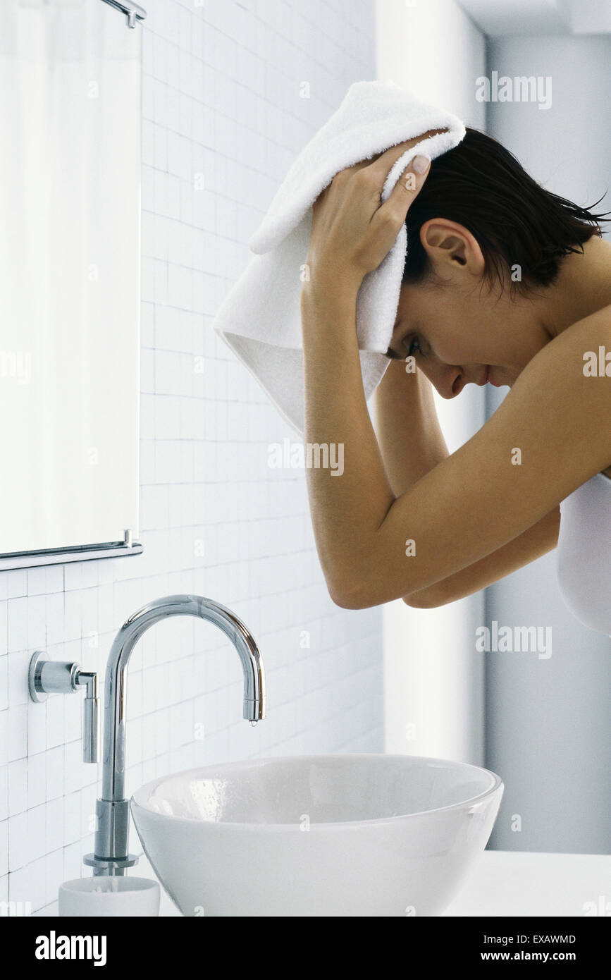 Woman drying off towel hi-res stock photography and images - Alamy