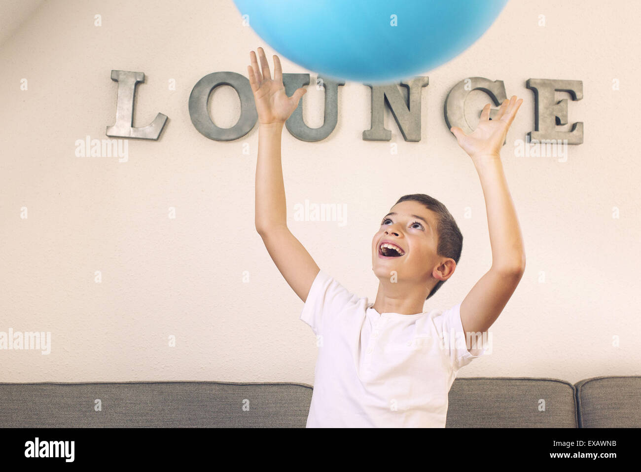 Boy catching large ball Stock Photo - Alamy