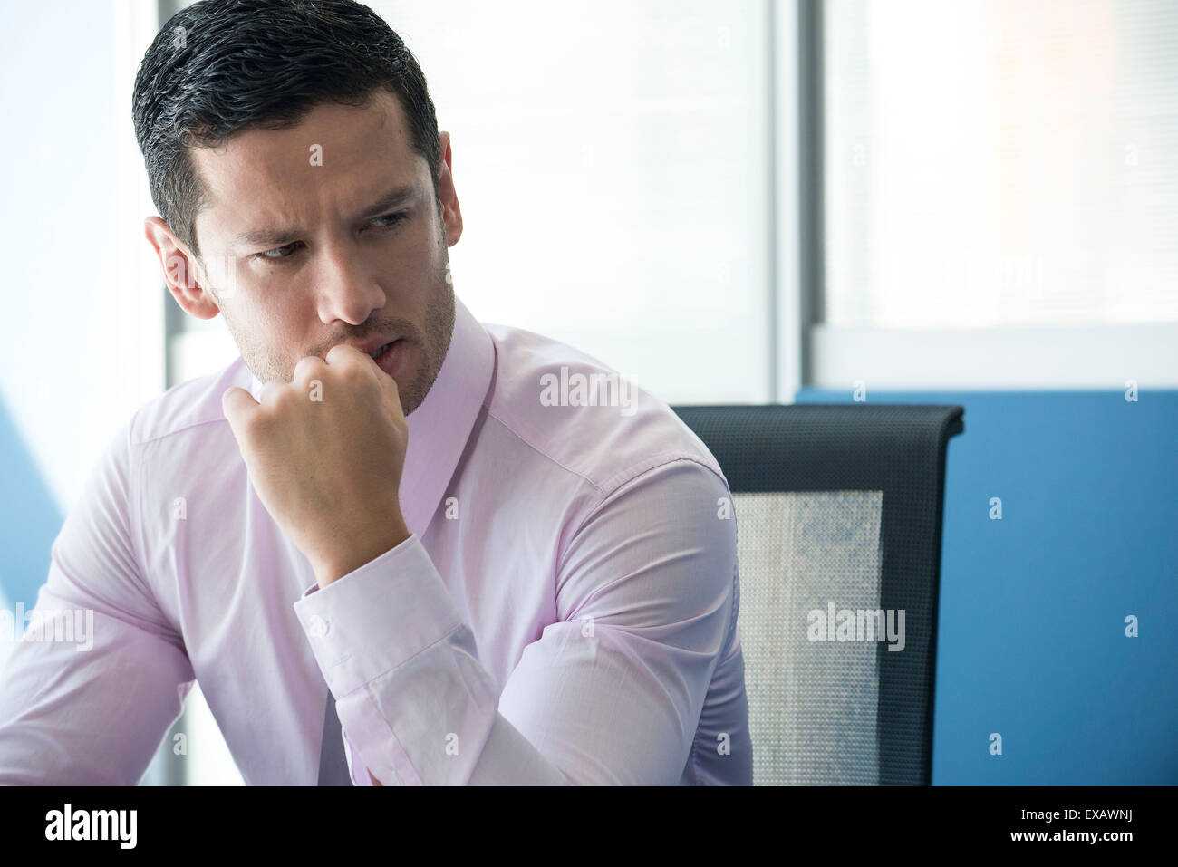 Businessman looking away concerned Stock Photo - Alamy