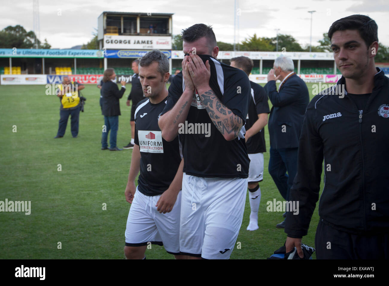Home defender Tony Davies leaves the pitch in disappointment after the ...