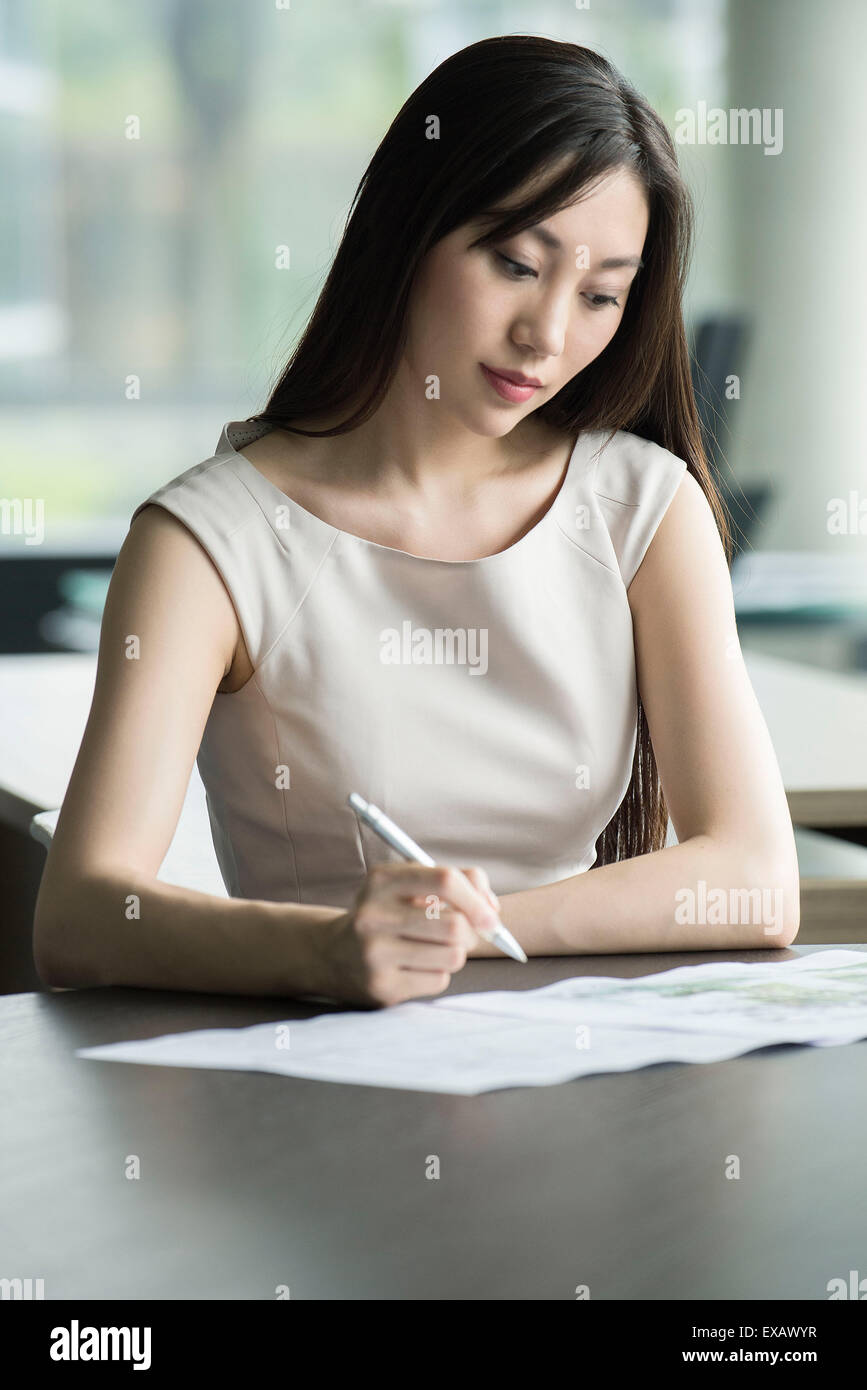 Office worker doing paperwork Stock Photo - Alamy