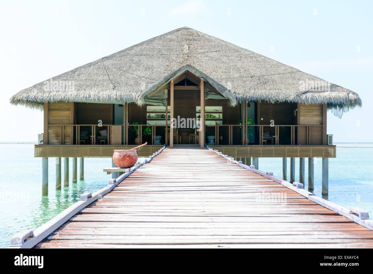 Overwater hut and jetty at a resort in Maldives Stock Photo - Alamy