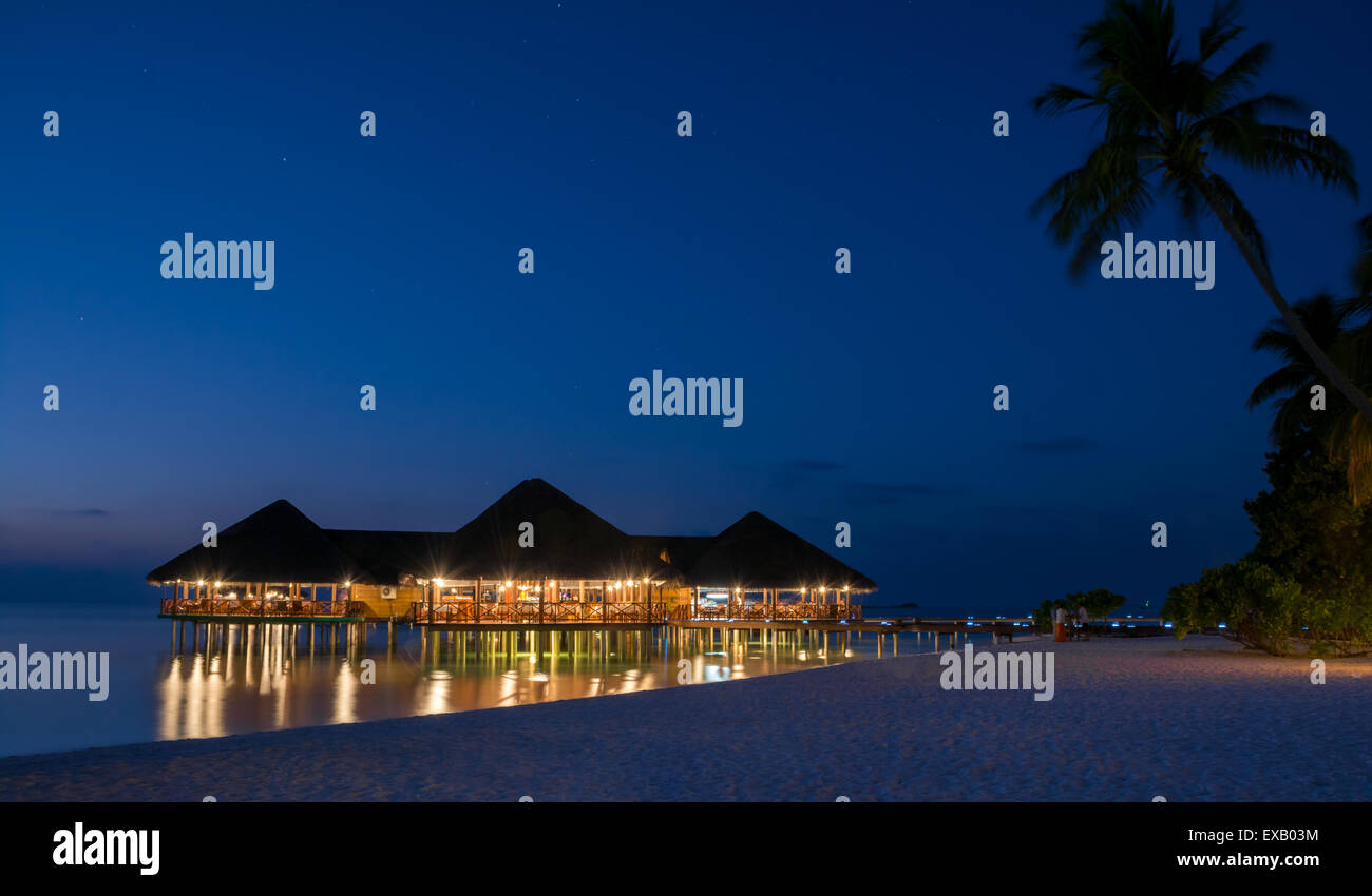 Overwater restaurant of an island resort in Maldives Stock Photo - Alamy